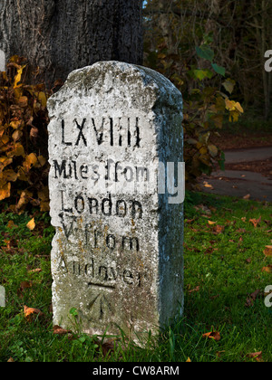 An old weathered Roman Milestone on the side of the road showing ...