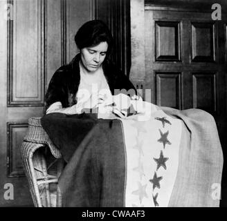 Alice Paul (1885-1977) sewing another star onto the "Suffrage Flag ...