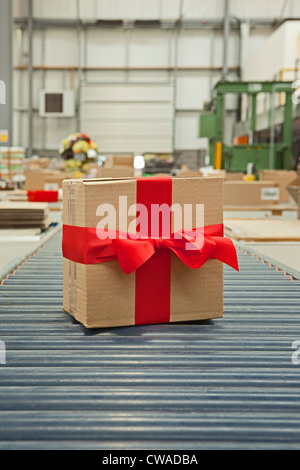 Packed gift with tied bow on metallic background holiday concept Stock ...