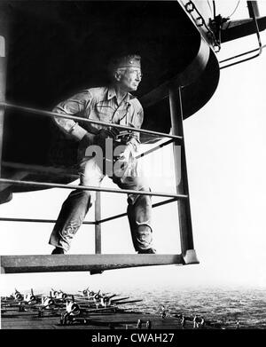 Lt. Commander Edward Steichen (1879-1973) holding camera, standing on ...