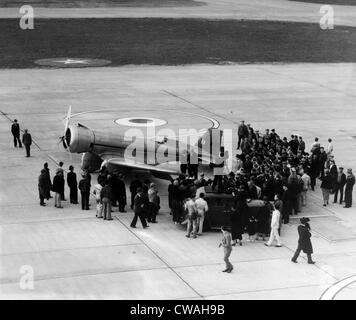 Howard Hughes lands at Floyd Bennett Airport in his silver monoplane ...