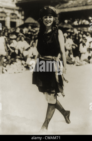 Margaret Gorman, the first Miss America of 1921. She is escorted by ...