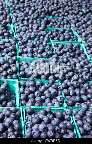 Many boxes of blueberries with soft background at the Farmers Market ...