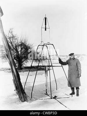 Robert H. Goddard (1882-1945), standing next to the first liquid fueled ...