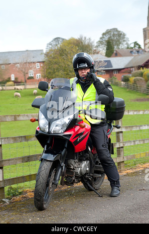 Motorcycle courier working in rural Leicestershire, England Stock Photo ...