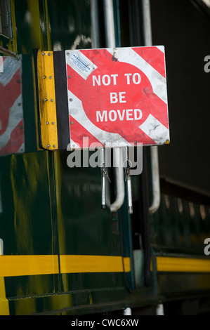 Not To Be Moved sign fixed to a train undergoing maintenance in a depot ...