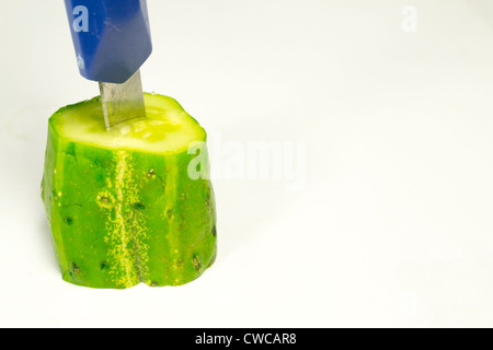 Wounded cucumber with a knife in the back Stock Photo - Alamy