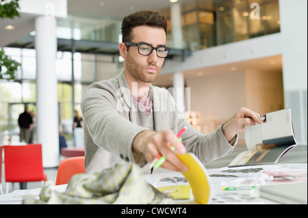 Male designer working in office Stock Photo - Alamy
