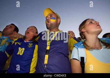 Germany fans sing their national anthem and wave flags before the World ...