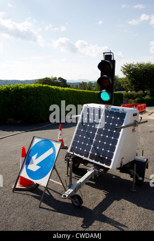 temporary solar powered traffic control lights at a street intersection ...