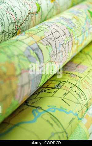 Various colorful road maps folded Stock Photo - Alamy