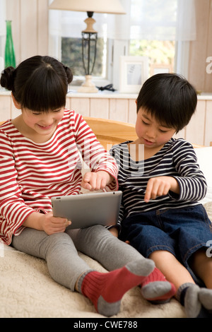Japanese kids using tablet Stock Photo - Alamy