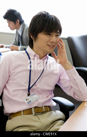 Smiling business people in their office Stock Photo - Alamy