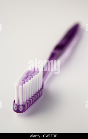 Pink toothbrush on white background Stock Photo - Alamy
