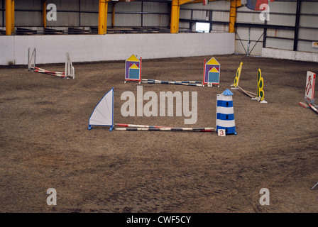 Indoor horse jumping arena Stock Photo - Alamy