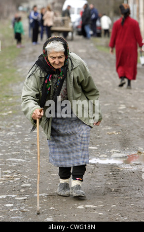 The woman has a stooped posture Stock Photo - Alamy