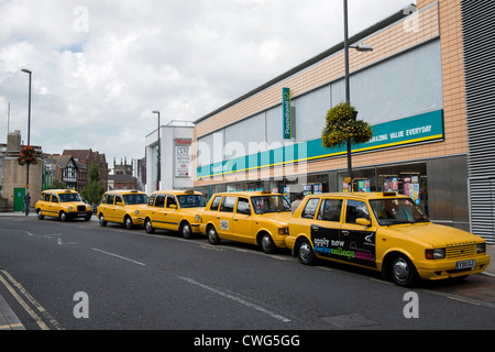 Taxi rank queue of London cab waiting outside the Phase 2 extension to ...