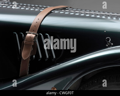 Classic car leather bonnet strap Stock Photo - Alamy