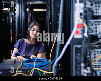 Indian businesswoman working in server room Stock Photo - Alamy