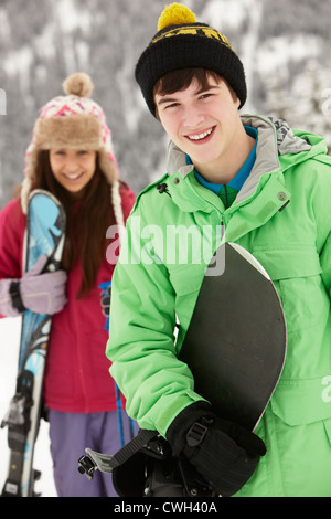 Teenagers snowboarding together Stock Photo - Alamy