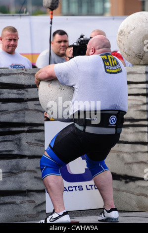 Strong man lifting heavy stone Lebanon Middle East Stock Photo - Alamy