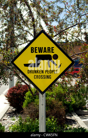 Drunken people crossing warning sign showing a drunk man crawling in ...