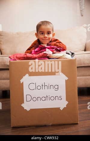 The boy is donating Stock Photo - Alamy