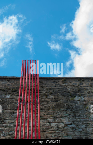 Stone Wall With Red Pipes Stock Photo - Alamy