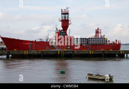 A bright red lighthouse, Lightship / Light Ship Vessel moored at ...
