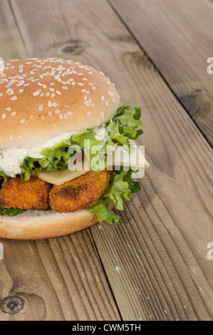 Fish burger baked fish hamburger fresh cheese tomato salad Stock Photo ...
