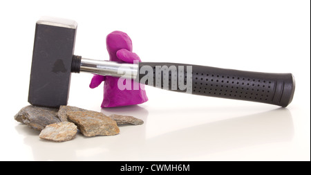 Modelling clay figure with a sledge Stock Photo - Alamy