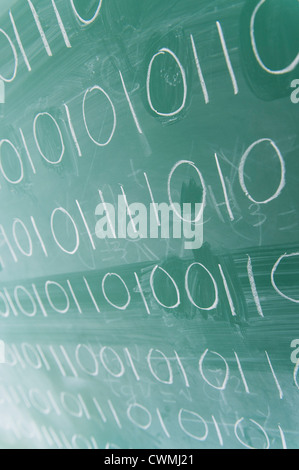 Binary code on blackboard Stock Photo - Alamy