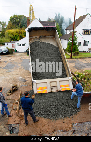 Tipper lorry unloading aggregate Stock Photo - Alamy