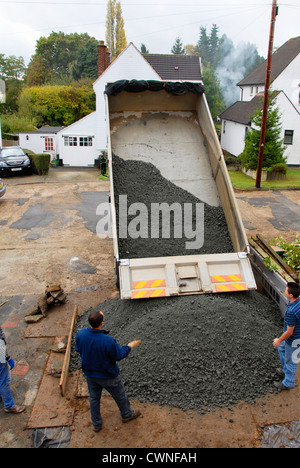 Tipper lorry unloading aggregate Stock Photo - Alamy
