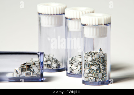 Small electronic components in tubes Stock Photo - Alamy