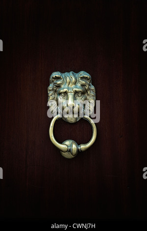 Door handle knocker selective focus on brown old wooden church entrance ...