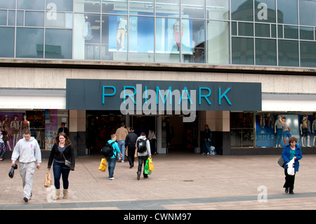 Primark clothing store entrance back view of customers beside window ...
