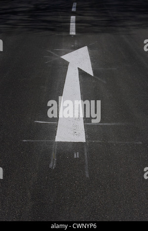 Germany, Bavaria, View of white arrow sign marking on road Stock Photo ...