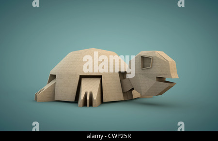 tortoise origami made with cardboard paper isolated on blue background ...