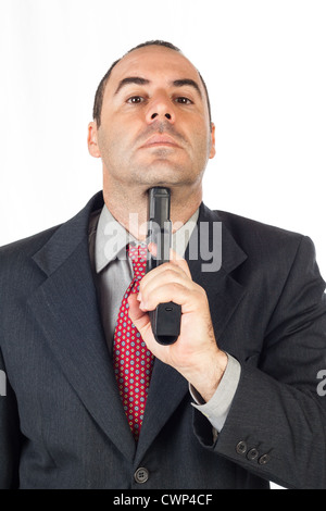 Suicidal man pointing at his head with a gun gesture as he screams in ...