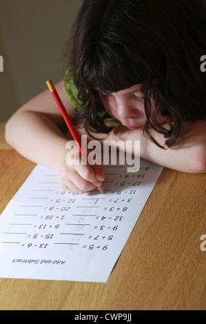 little girl doing maths homework Stock Photo - Alamy