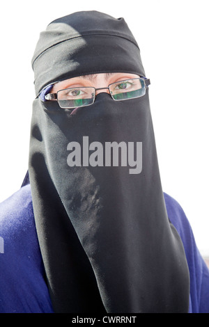 Young Muslim Lady in full body burka posing in front of sign at Muslim ...