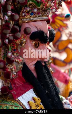 A mask of a taoist god at the "Pigs of God" festival around Chinese New ...