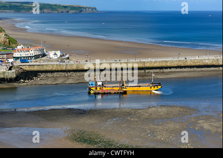 The Whitby Dredger ‘Sandsend’ dredging near the harbour entrance whitby ...