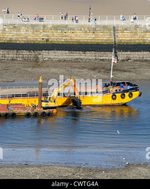 The Whitby Dredger ‘Sandsend’ dredging near the harbour entrance whitby ...
