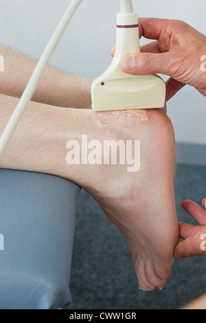 Doctor's Hand With Ultrasound Scan On Abdomen Of Male Patient Stock ...
