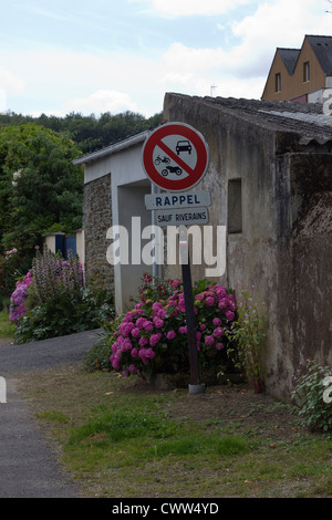 Sauf Riverains road sign Stock Photo - Alamy
