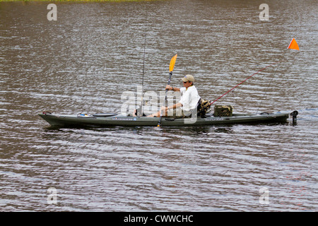 Fisherman paddling kayak on Withlacoochee River near Inverness, Florida ...