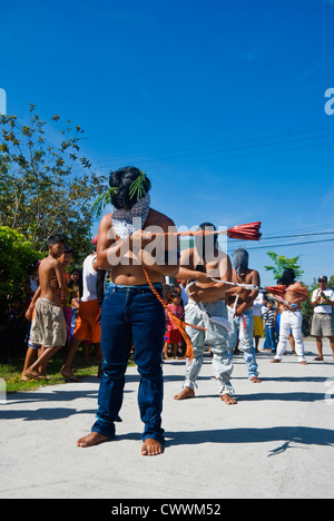 Flagellants scourge themselves with a rope tipped with small wooden ...