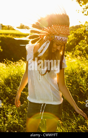 Front view of happy carefree native children: older teenage brother and ...